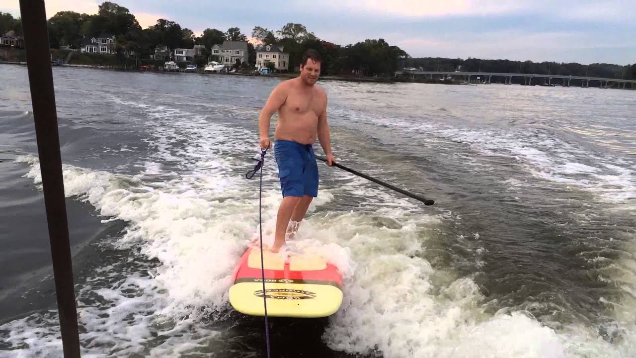 paddle board surfing in boat wake - YouTube