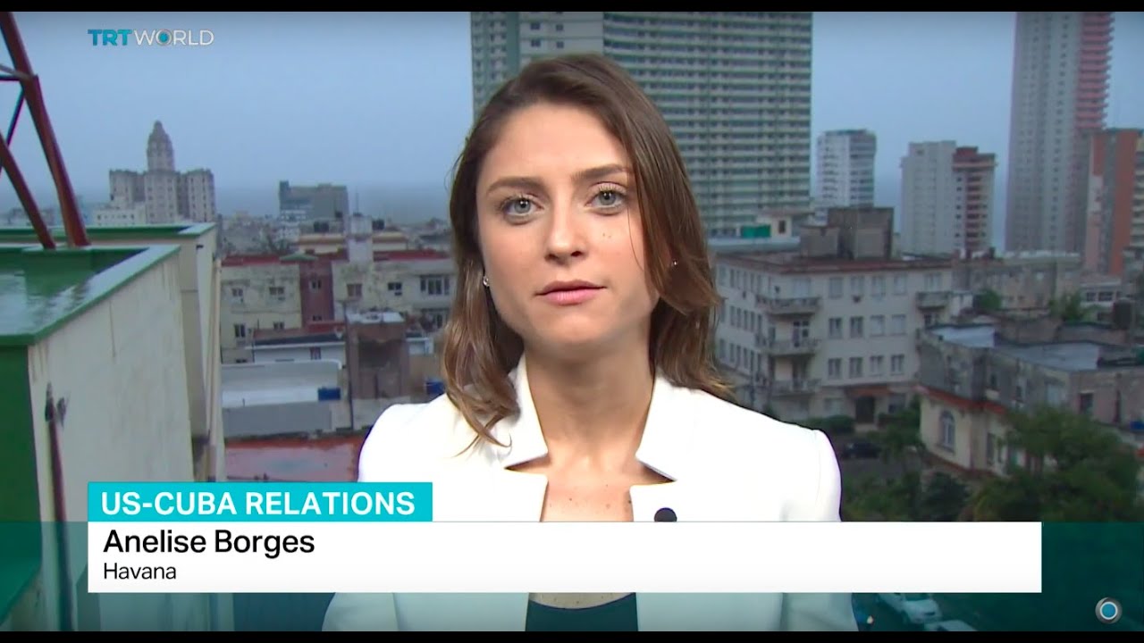 Reaction to Obama's arrival in Cuba mixed, Anelise Borges reports - YouTube