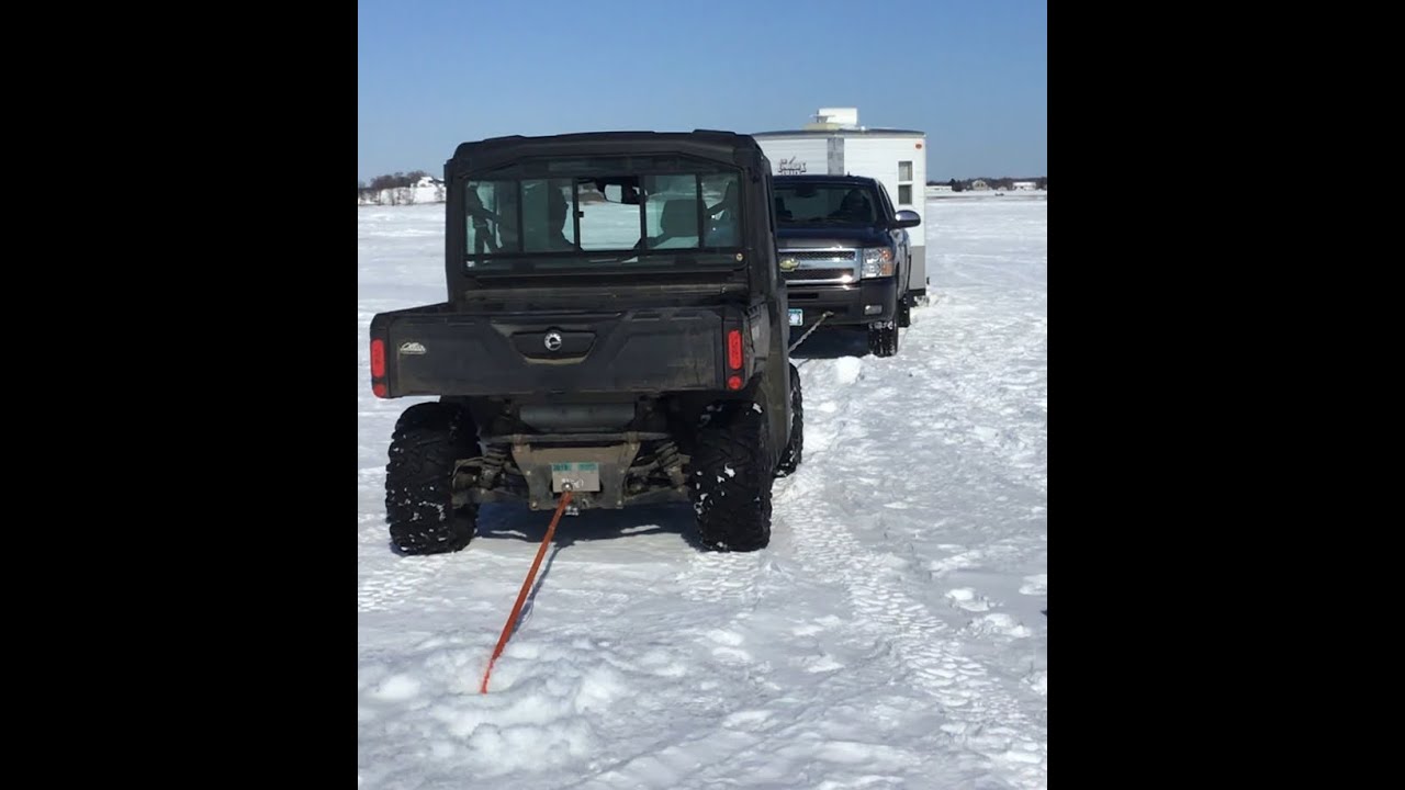 Arctic Anchor Anchored UTV pulls a stuck pickup and fish house free ...
