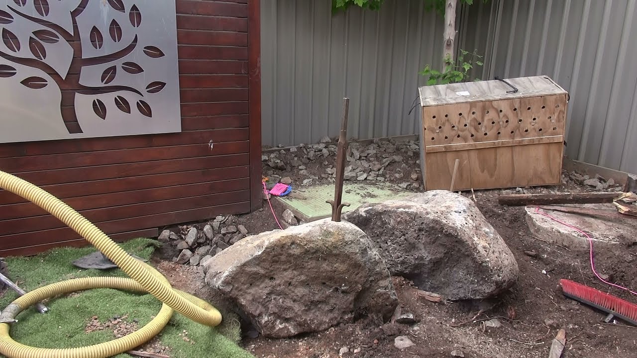 Breaking basalt rock with plugs and feathers - YouTube