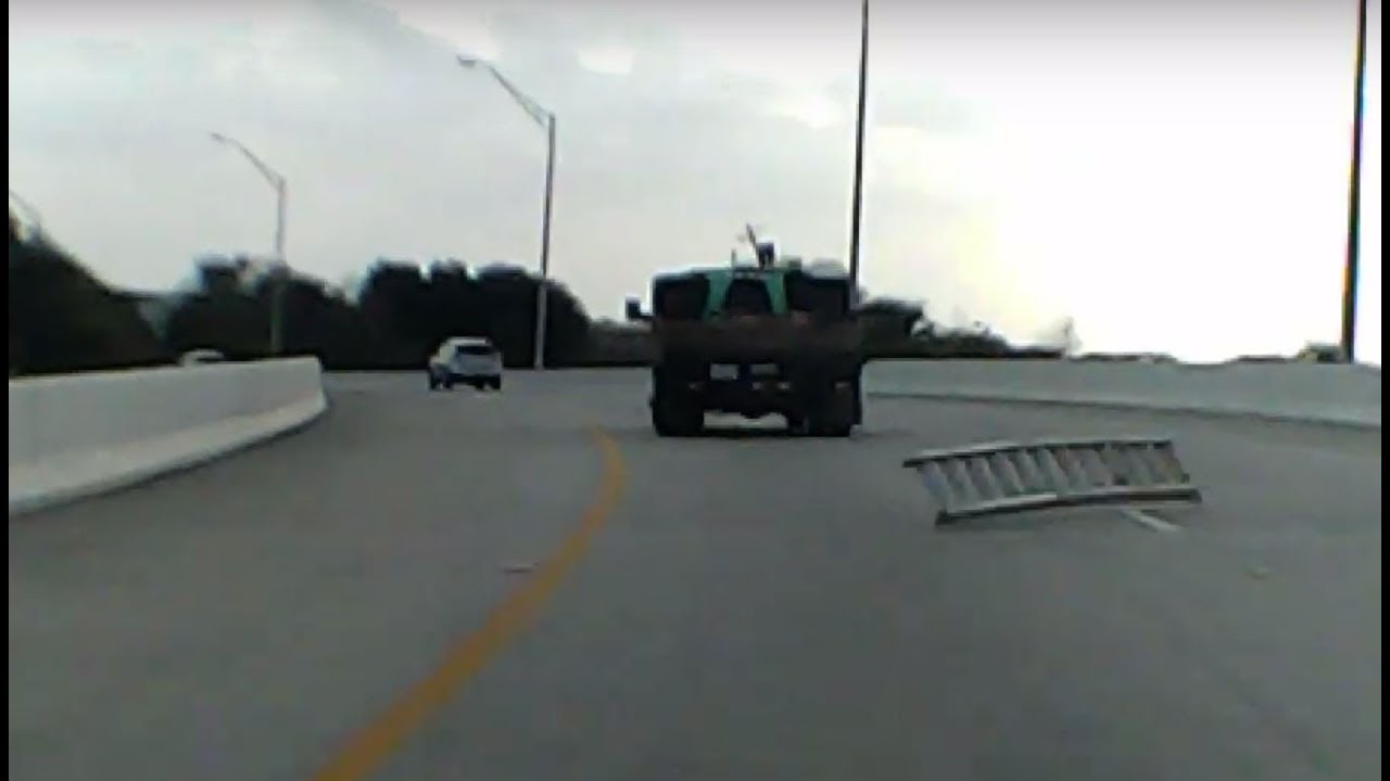Danger on Florida Highways. A ladder flies off the back of a truck ...