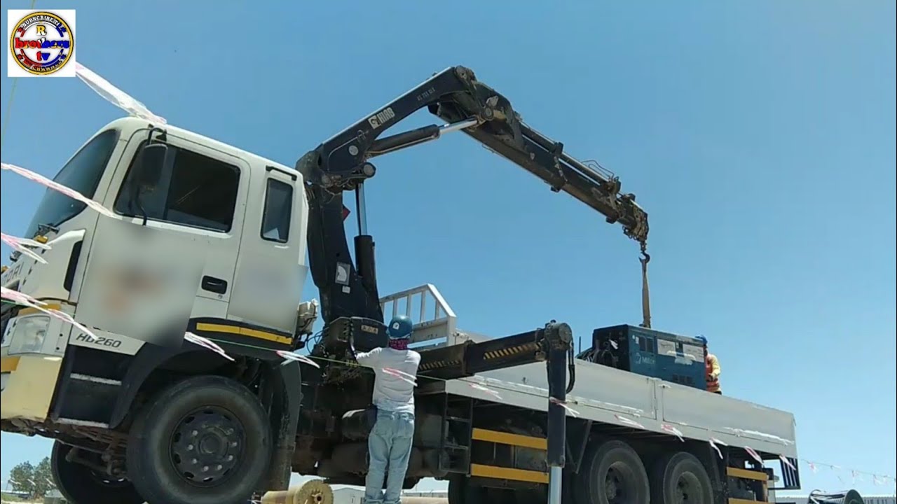 Unloading welding generator using boomtruck - YouTube