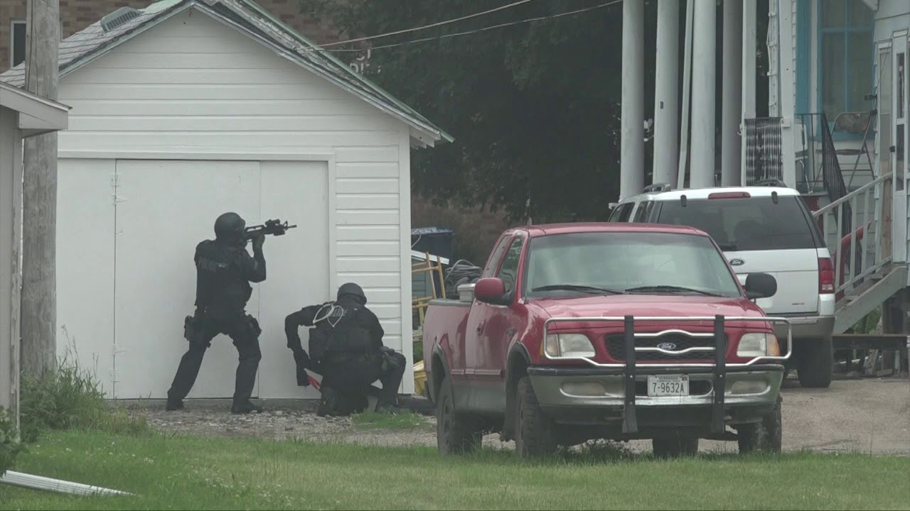 Police work to establish perimeter as shooter holes himself in house ...