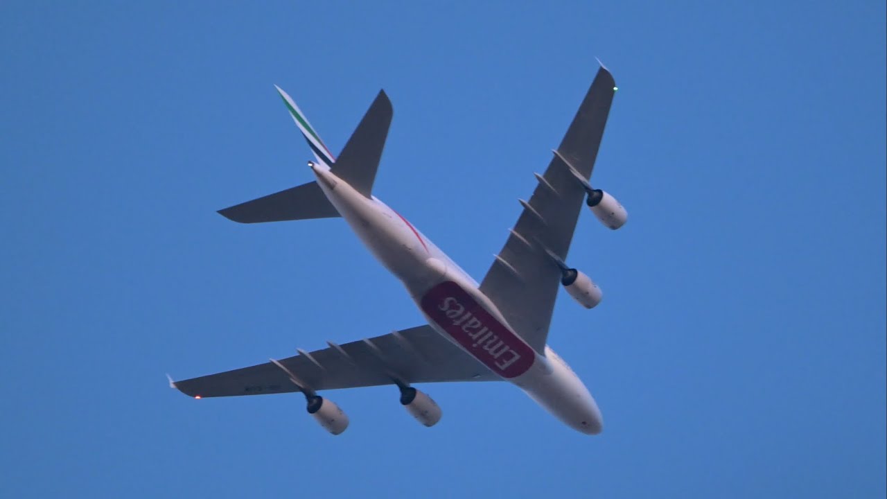Emirates Airbus A380 flying past the clouds at dusk - YouTube