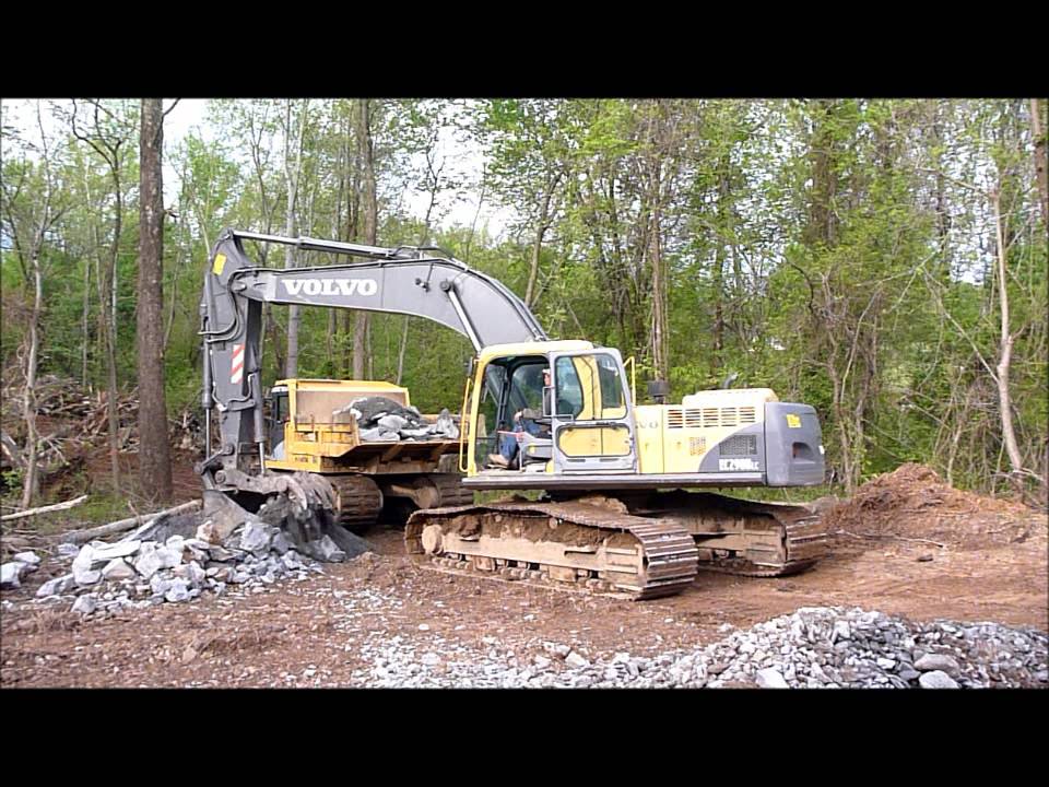 Volvo 290 Excavator Loading Komatsu Track Truck - YouTube