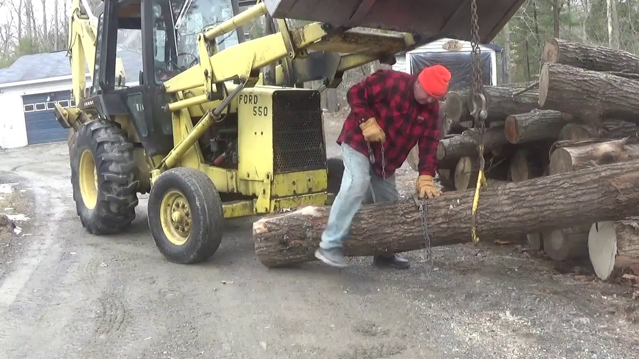 Loading the sawmill with a lower grade log. - YouTube