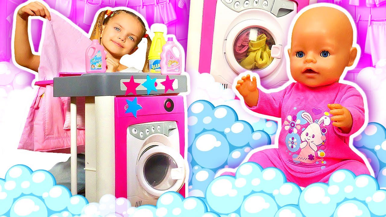 Time to wash the doll's laundry in a toy washing machine! Change the ...