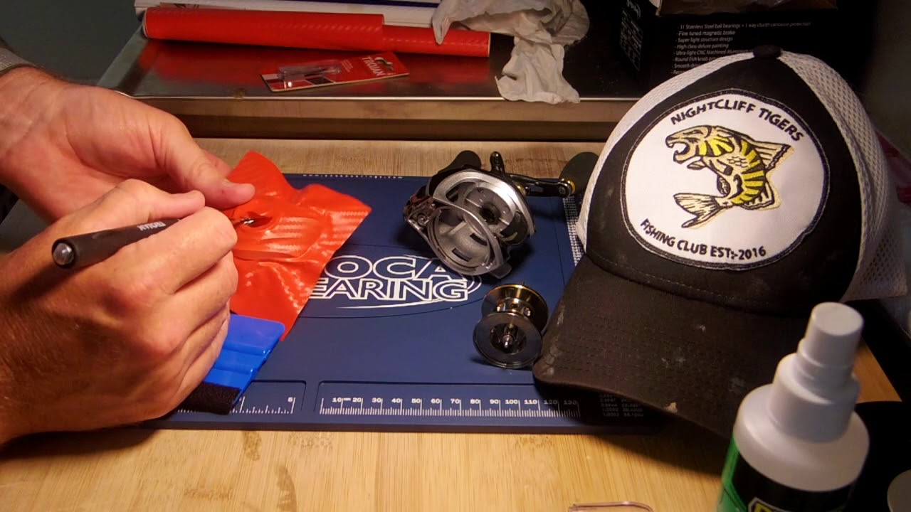 How to vinyl wrap on bait cast reel - YouTube