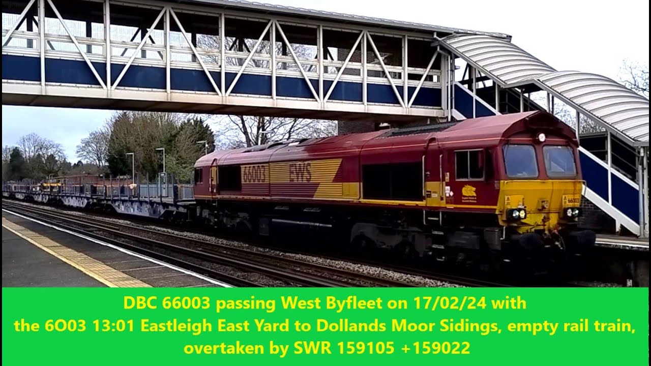 DBC 66003 passing West Byfleet on 17/02/24 with an empty long welded ...