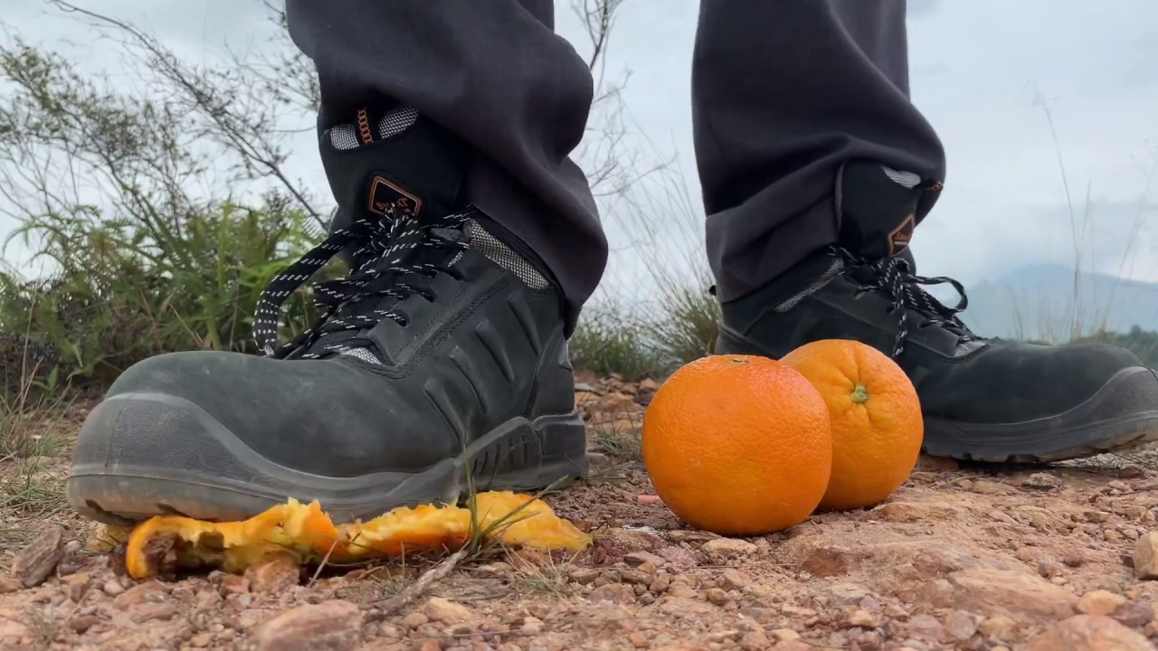 Work boots stomp oranges - YouTube
