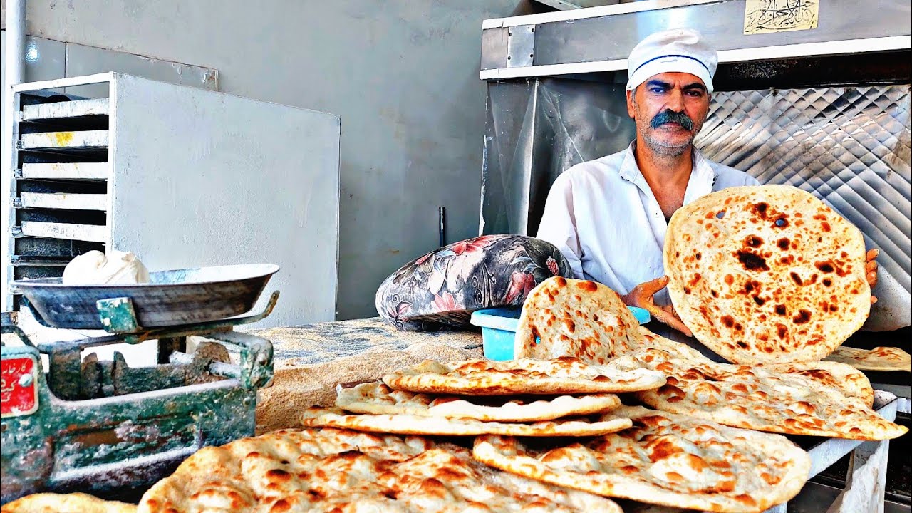 Baking delicious and crispy tafton bread in the bakery: Tafton bread ...