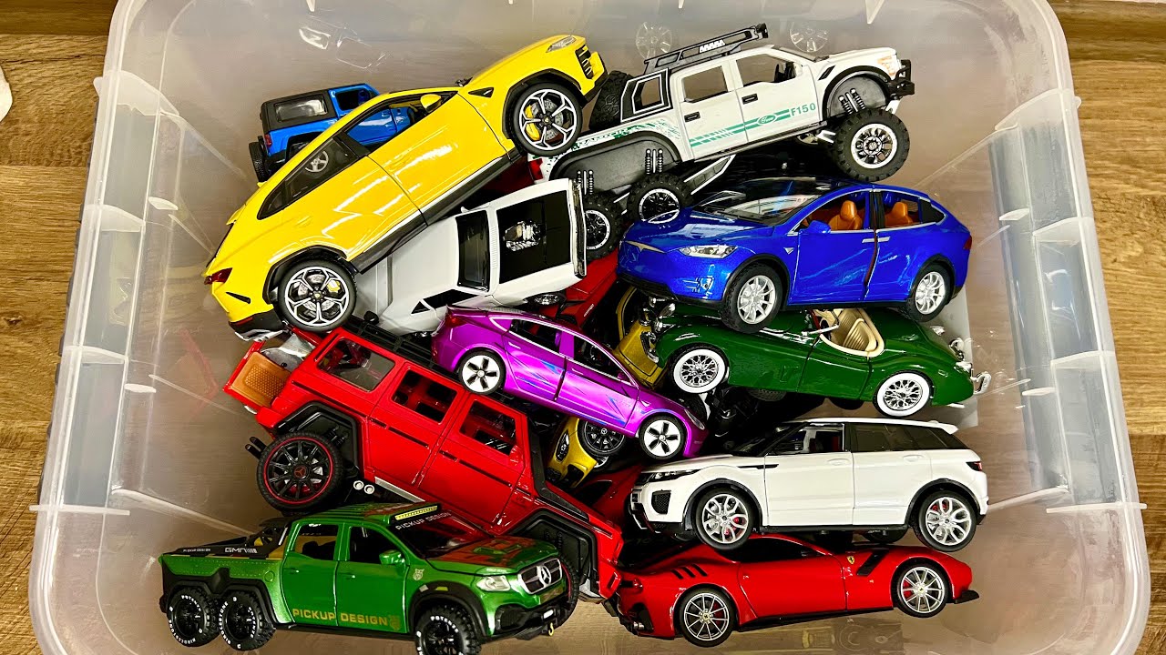 Box full of various miniature cars Peugeot, Volvo, Renault, Hyundai ...