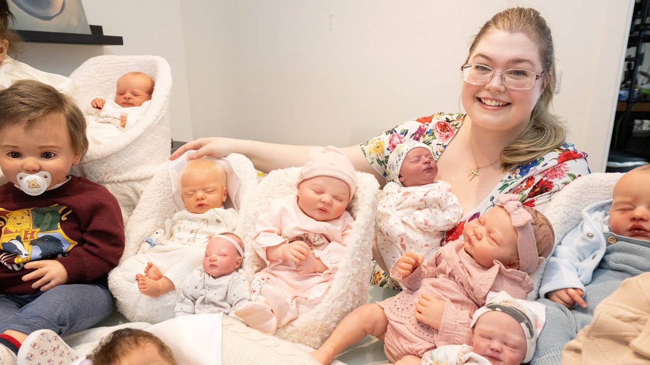Newlyweds trying for a baby "practice" by changing nappies on 35 reborn ...