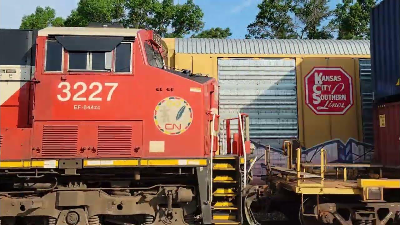 CN 3292 Westbound auto carriers meets CN 2837, 3227 Eastbound intermodal containers in well cars ...
