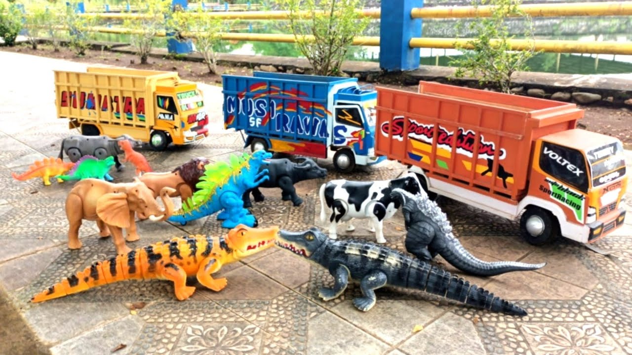 Truk oleng muat mainan, Tiger, kerbau, dinosaurus, stegosaurus animal ...