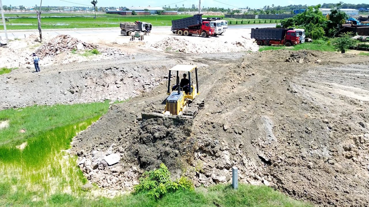 Mini Bulldozer Machines Working Clearing Land Filling With Dump Truck ...