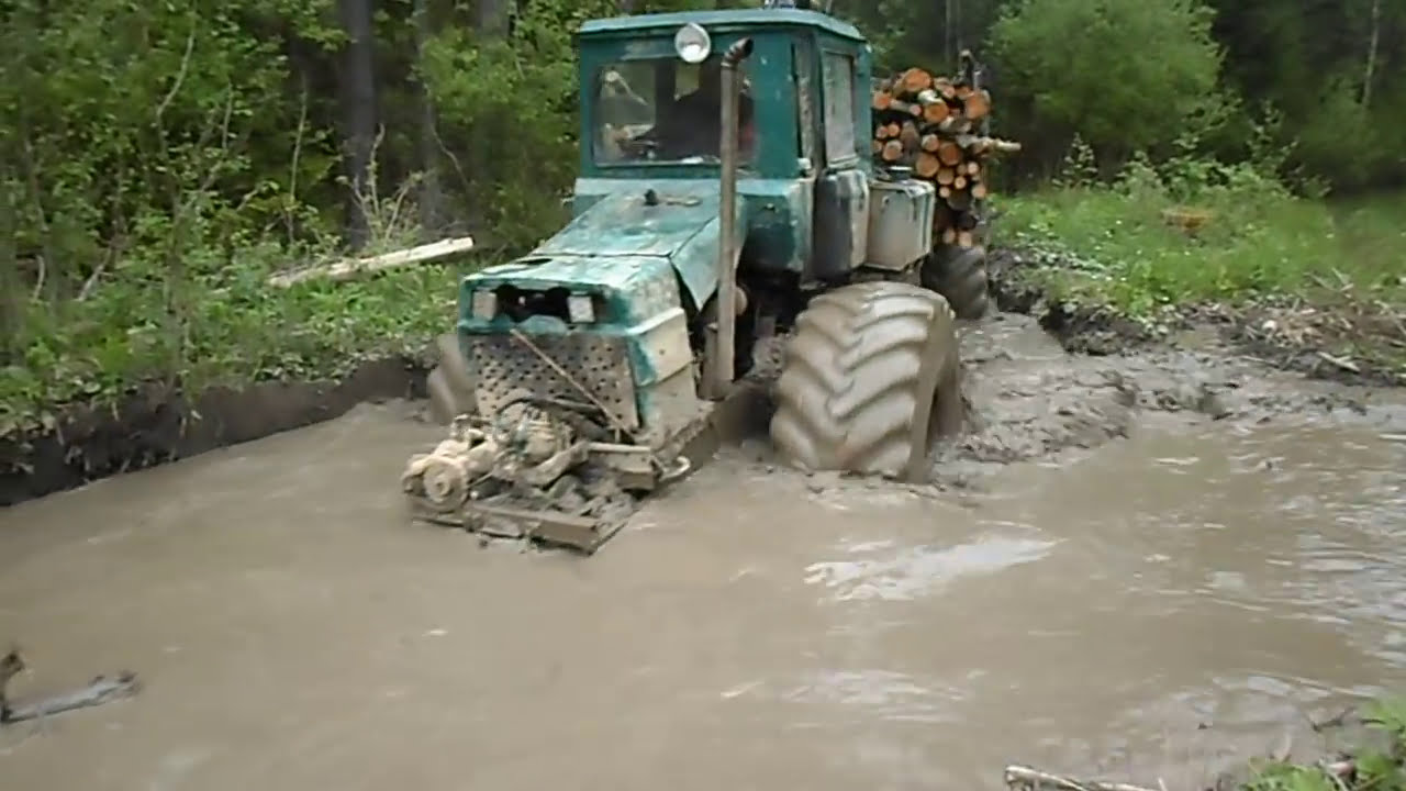 Homemade forwarder logging in wet forest - YouTube