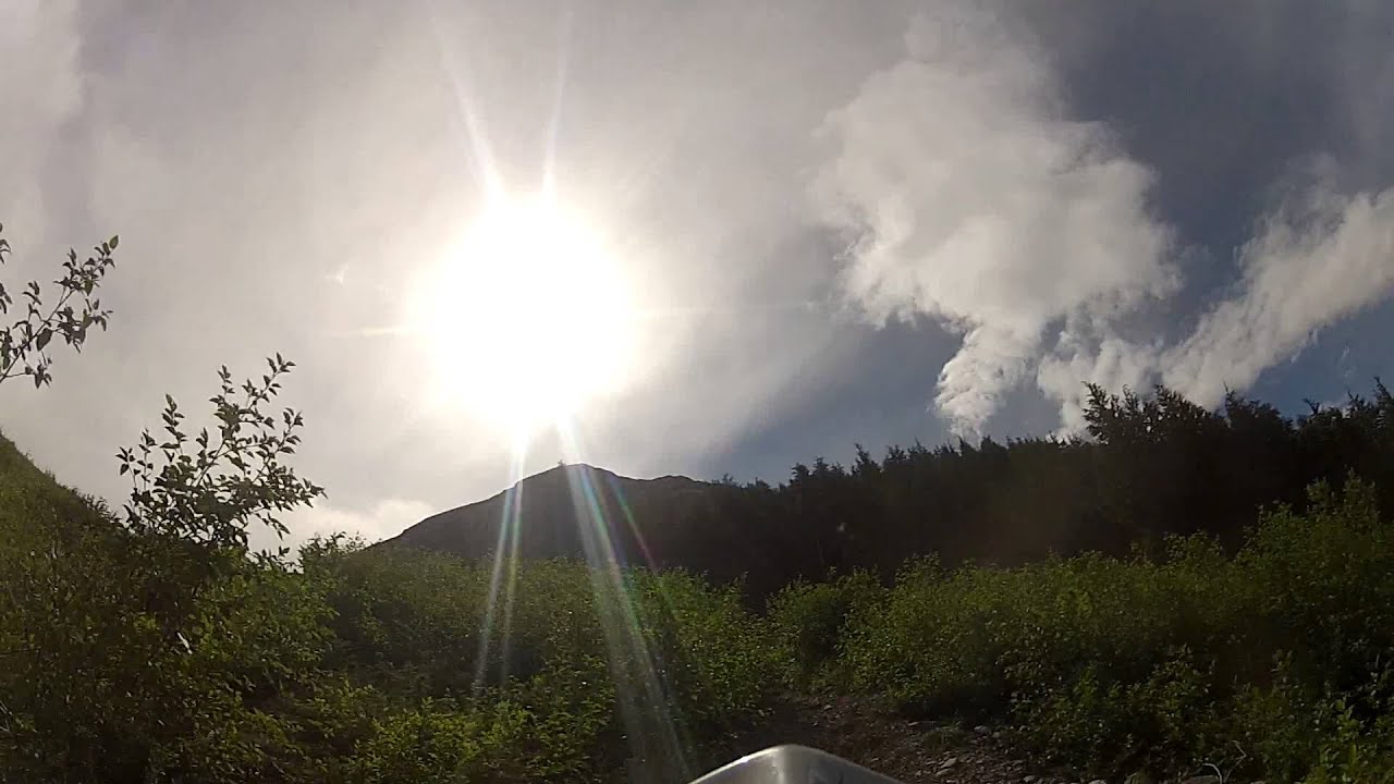 Riding Bikes at Alyeska in Girdwood Alaska. Backwards view of Tanaka ...