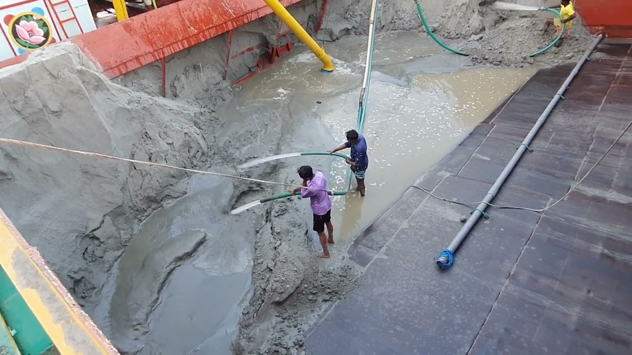 Three man work unload sand by big bulkhead ship powerful draser machine ...