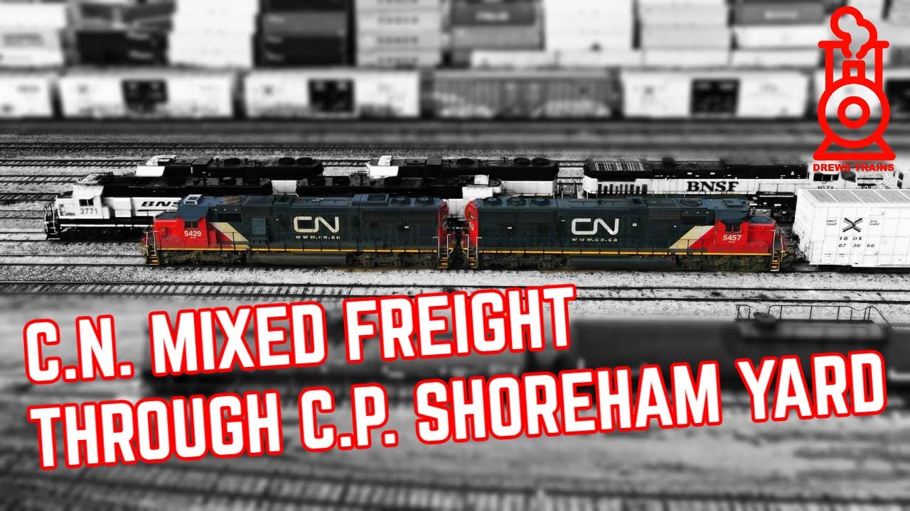 Canadian National freight train through Canadian Pacific Shoreham Yard ...
