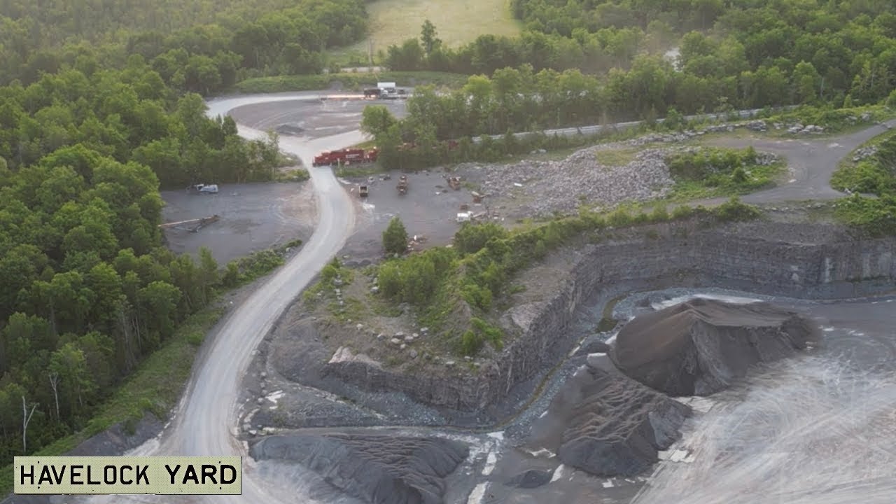 Train passes through Smith Quarry on the way to Nephton CPKC H06 - YouTube