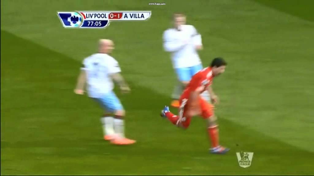 Luis Suarez booked for diving after a CLEAR fould...undeserved ...