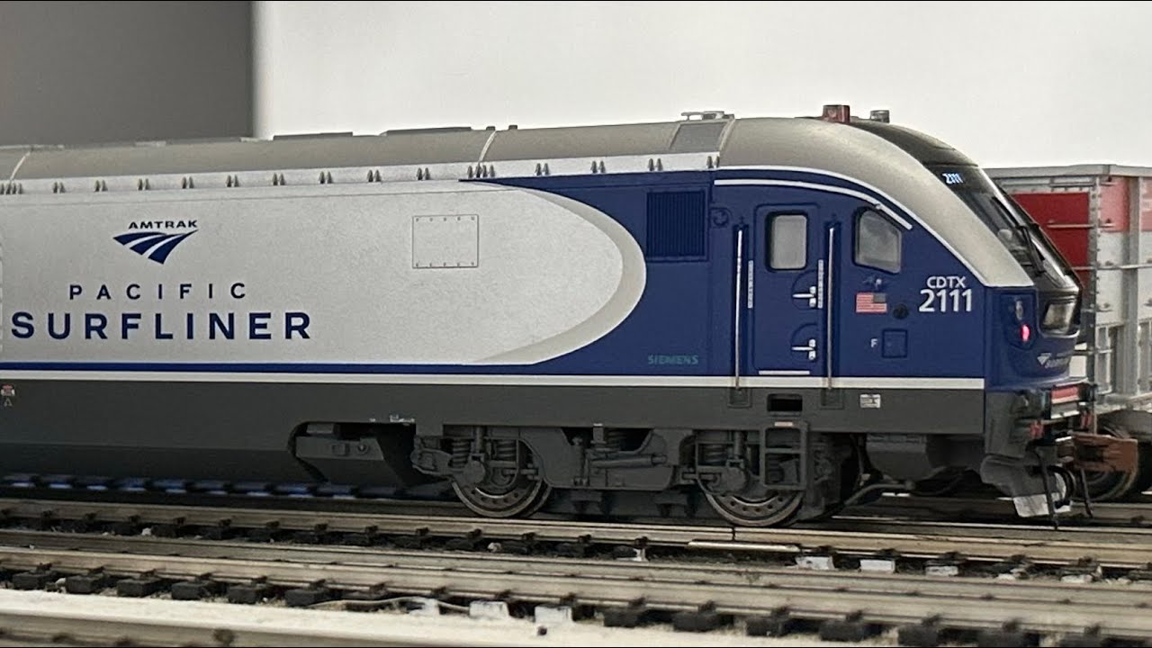 Amtrak Surfliner 767 passes Amazon train with Talgo set. - YouTube