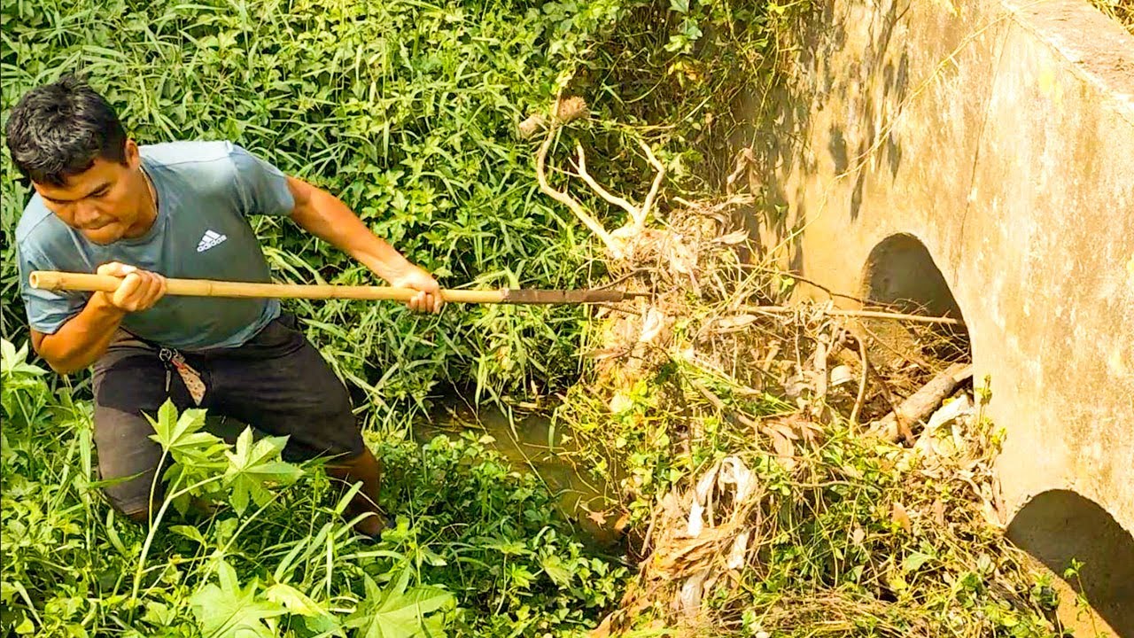Unclogging Twin Culvert Drainage - Removal Trash And Plastic Clogged ...