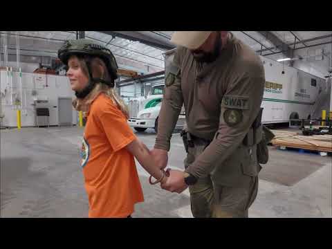 Kid tries on handcuffs (part 3)