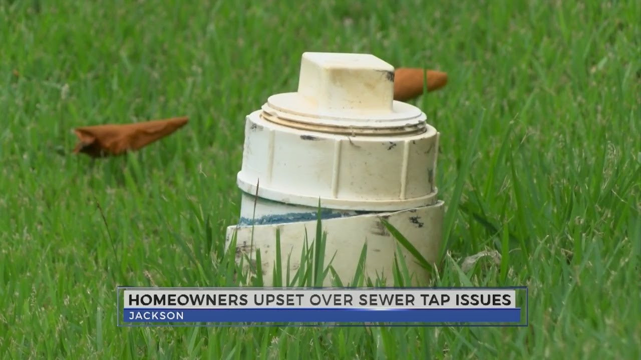 Homeowner upset over sewer tap issues - YouTube