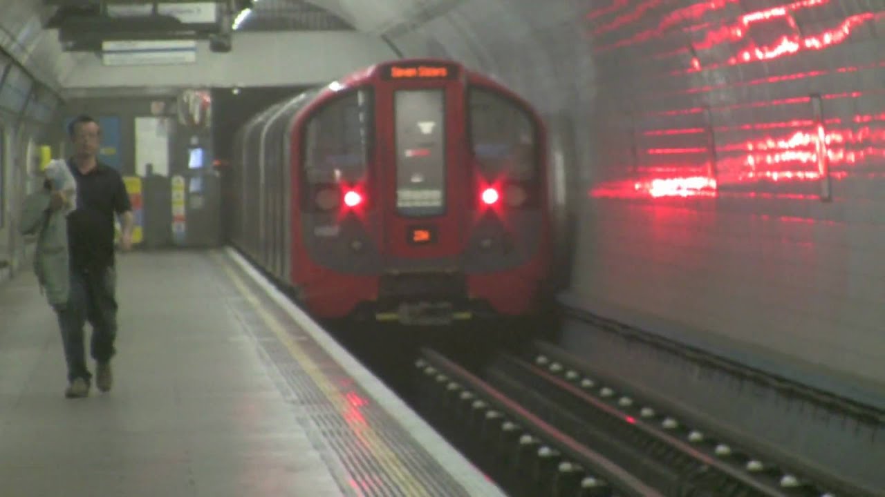 Victoria line 2009 Stock train departs Seven Sisters - YouTube