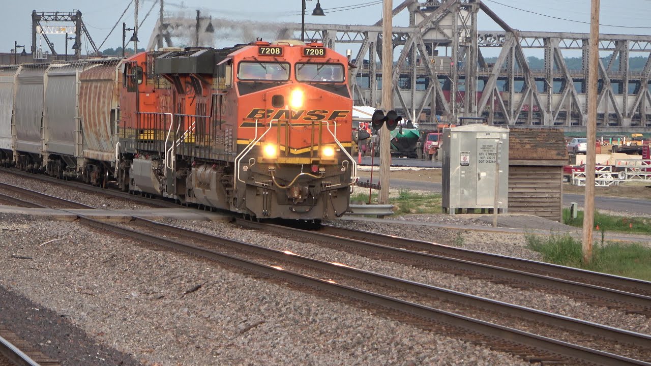 BNSF 7208 leads manifest across the Mighty Mississippi River into Ft. Madison IA past Kingsley ...