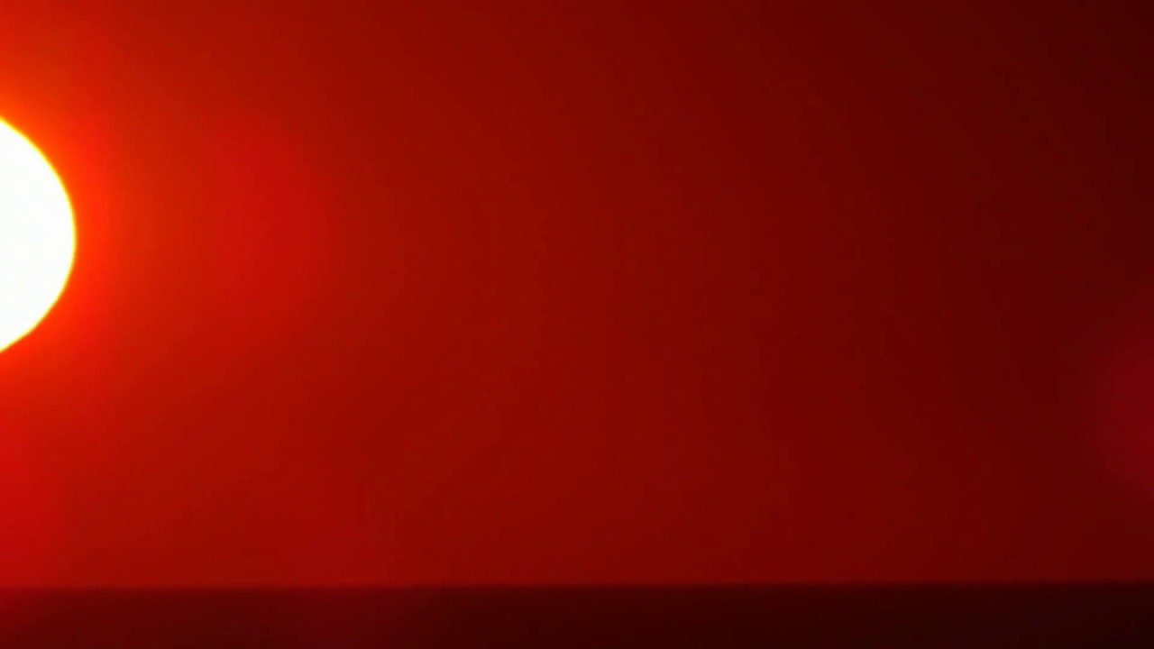 Sun setting in a cloudless sky (time lapse) - YouTube