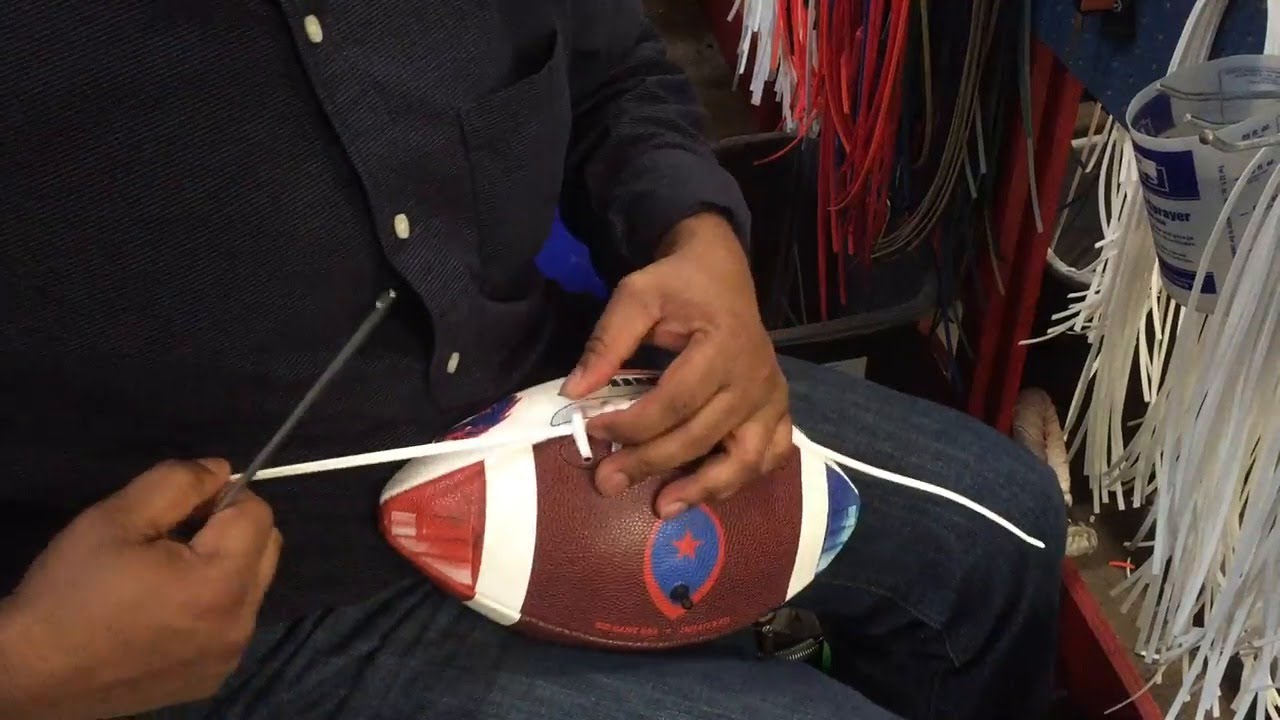 Watch a new football be laced at Big Game USA in two minutes - YouTube