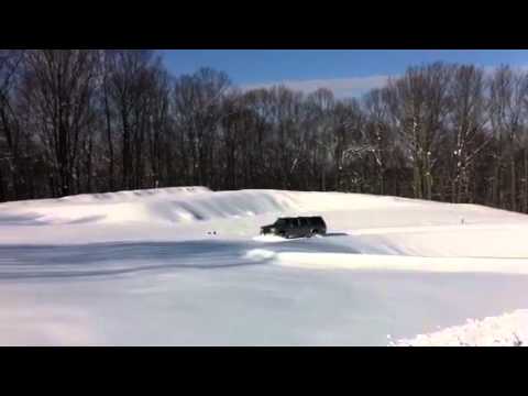 Lifted suburban 4x4 on 35's driving through deep snow - YouTube