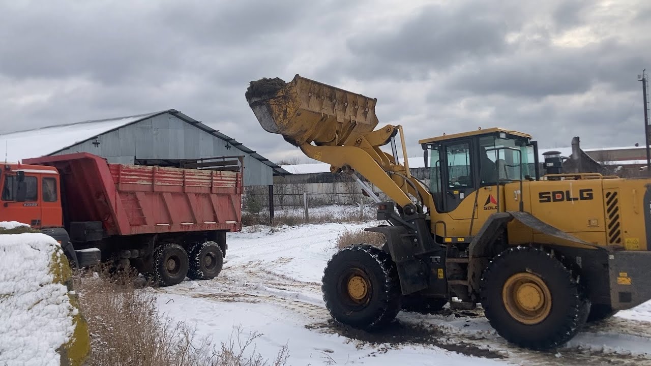LOADING WITH A FRONT LOADER INTO A DIP TRUCK IN WINTER - YouTube