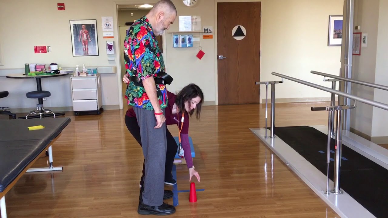 Physical therapy - placing each foot on a cone - YouTube