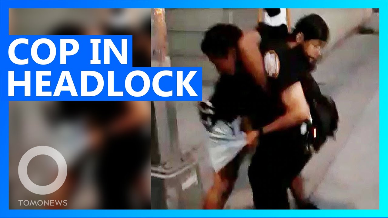NYPD Cop Put in Headlock While Trying to Disperse Crowd - YouTube