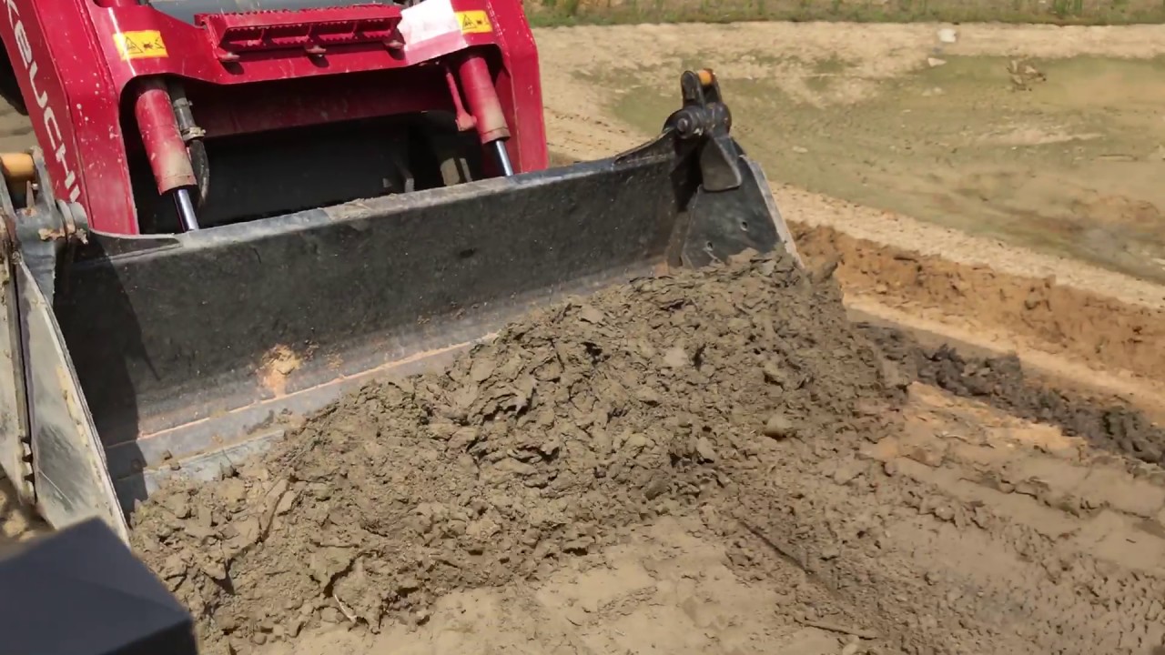 Grading pond dams - YouTube