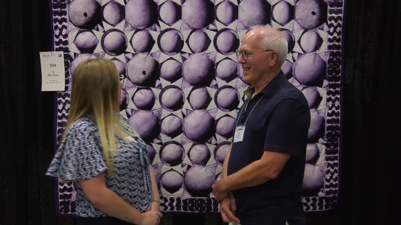 Paul Breuer Displays Three Bad Eggs Quilt at AQS QuiltWeek - YouTube
