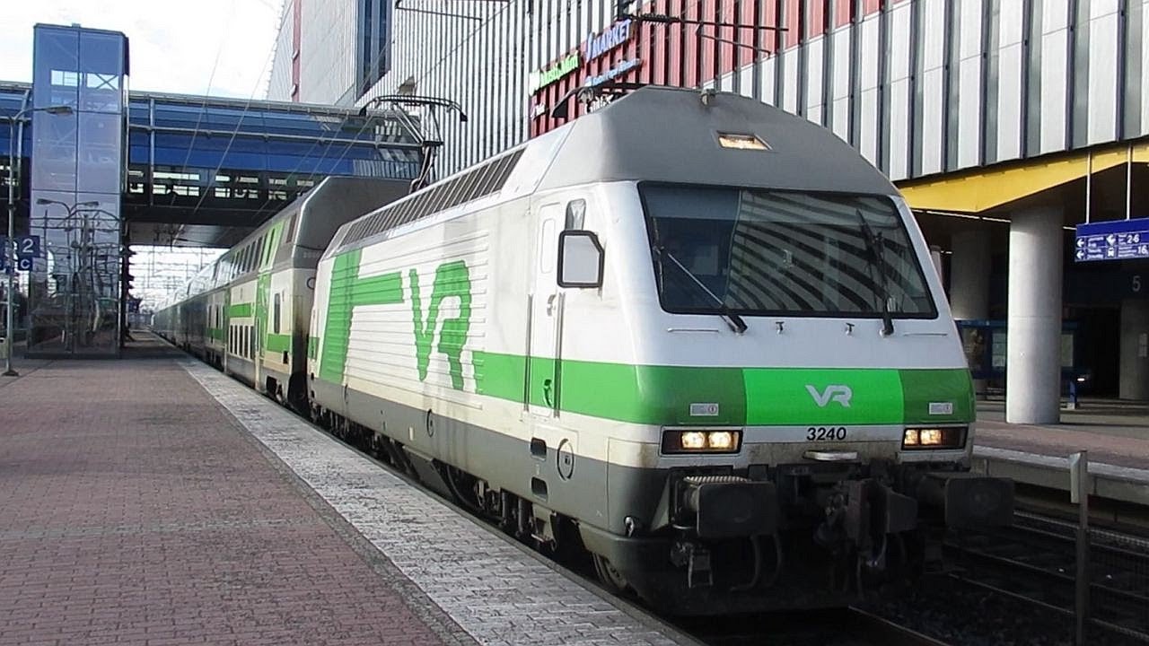 Finland: At Tikkurila, a VR class Sr2 electric loco departs on a ...