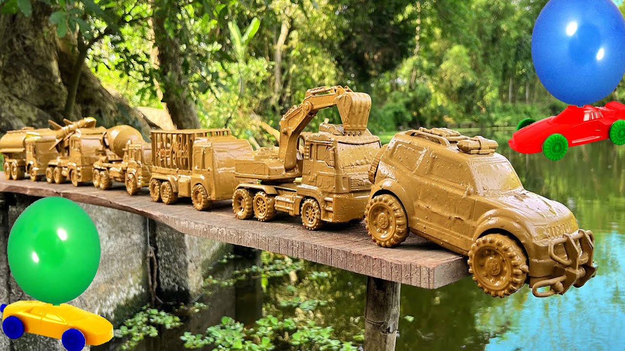 Drive the Muddy Toy Vehicle by hand and threw it into the water for ...