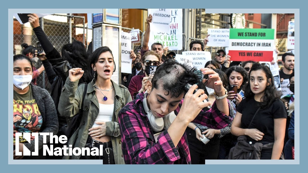 Protesters shave their heads outside New York Times building - YouTube