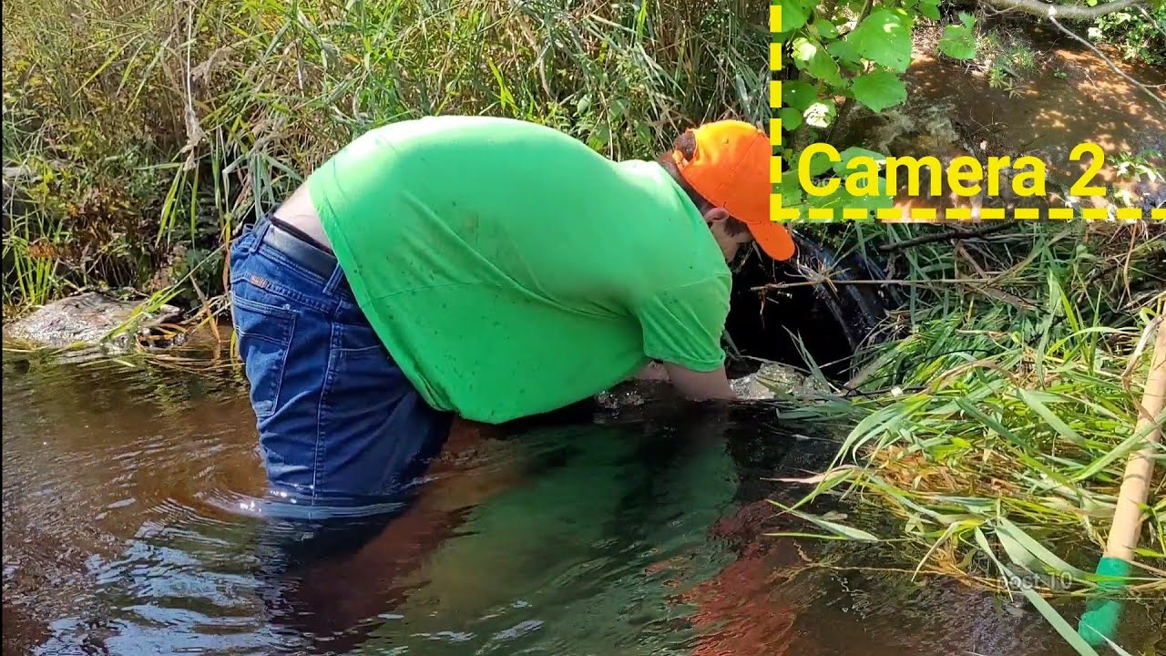 Unclogging 2 Badly Plugged Culvert Pipes To Drain Roadway - YouTube