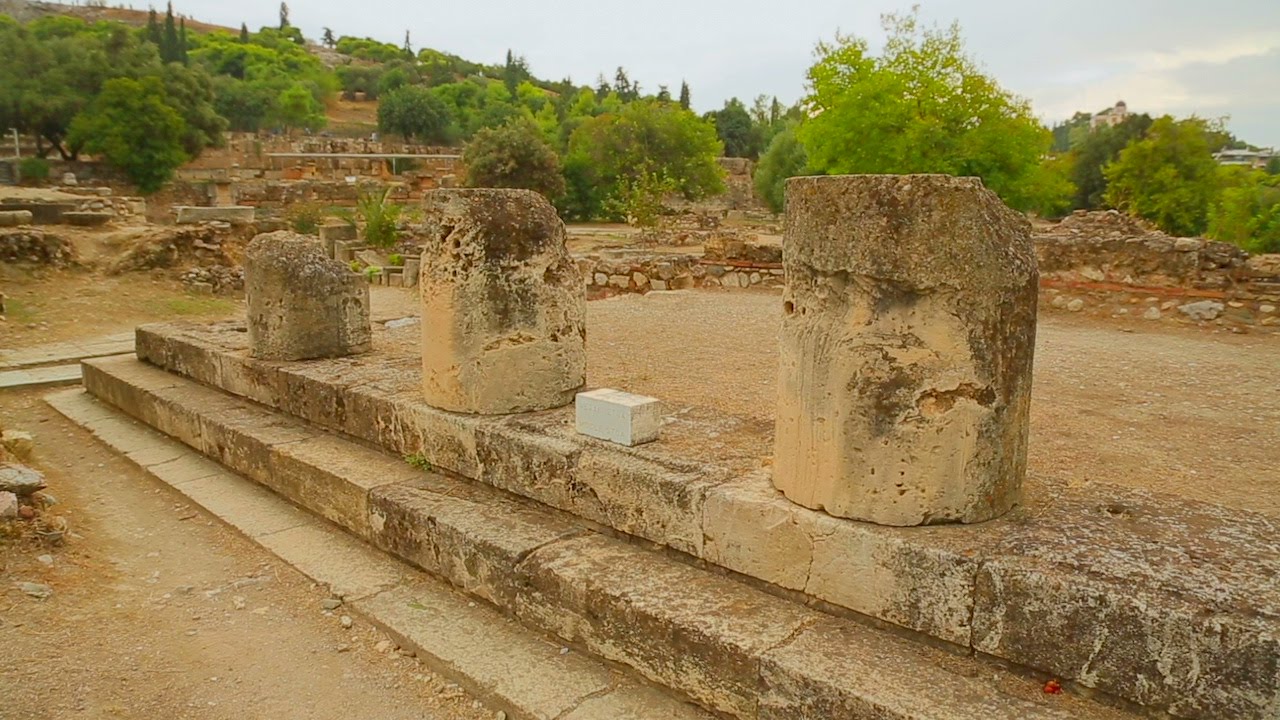 Pieces of marble columns, stone remains of stoa, ancient Greek ...