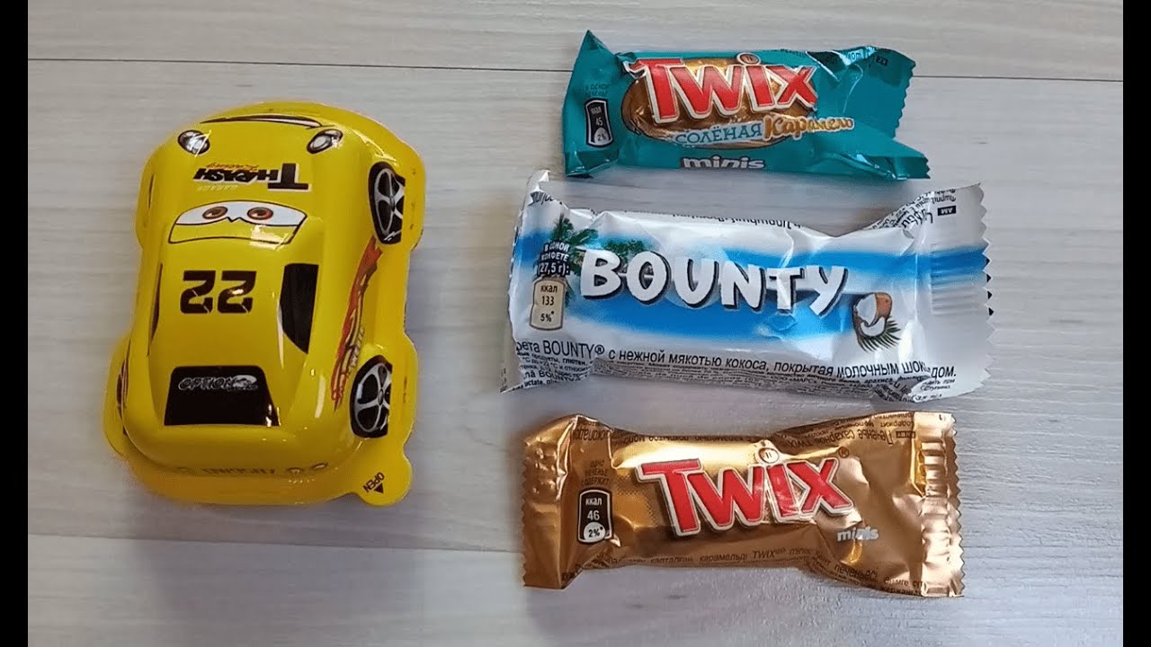 Learning colors with sweets. Bright ASMR yellow car with toy, mini Twix ...