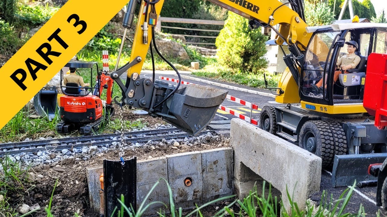 Drilling under the railway with missile mole. RC excavator Liebherr ...