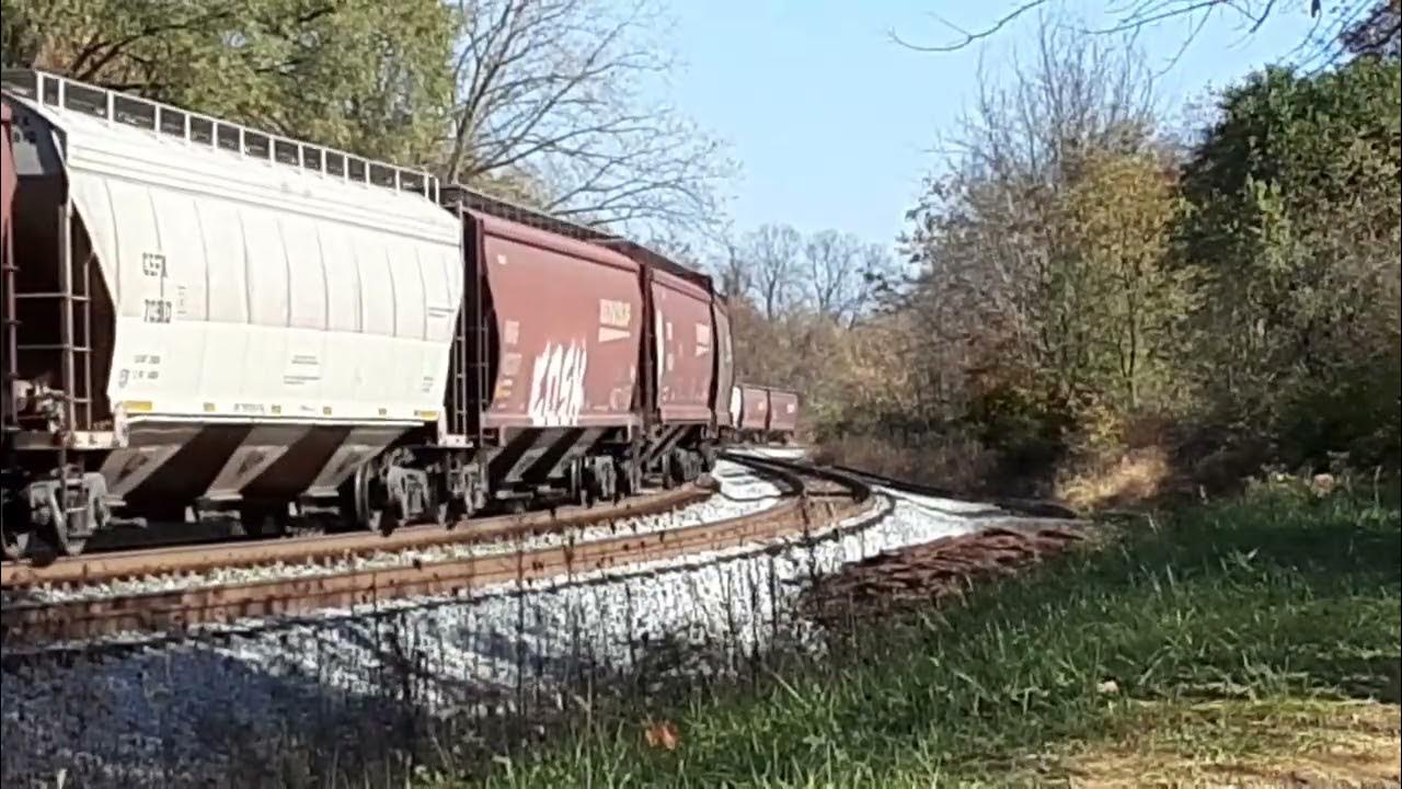 csx G110 empty grain train (bnsf) and csx G111 loaded grain train (bnsf) with H1 dash 9 (angle 2 ...