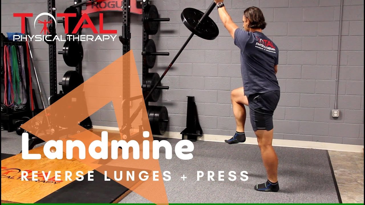 Landmine reverse lunge to marching press - YouTube