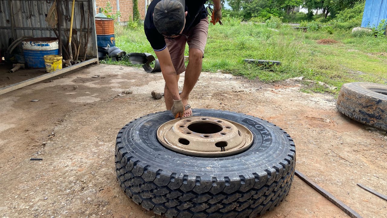 50 Ton dump truck tire after tire explosion on the rod. Changing New ...